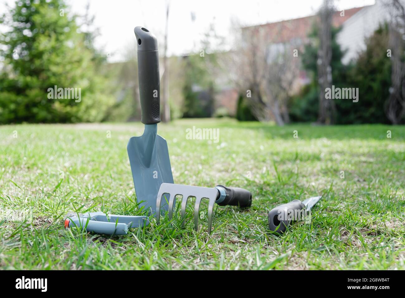 Gardening tools on the lawn Stock Photo - Alamy