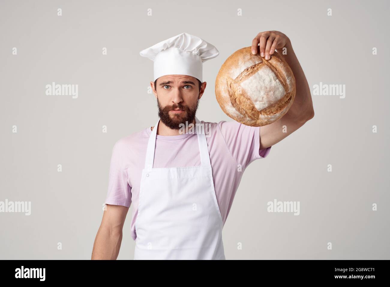 male chef with bread in his hands cooking baking Stock Photo - Alamy