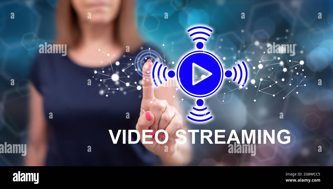 Woman touching a video streaming concept on a touch screen with her ...