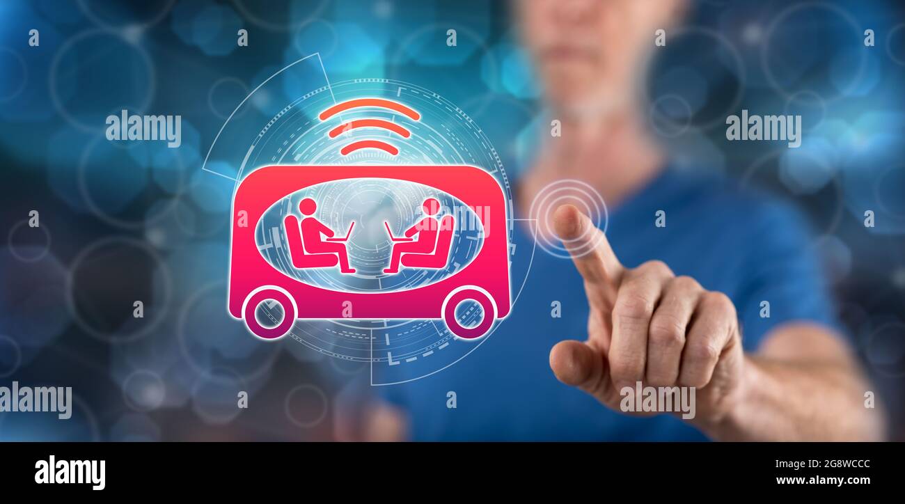 Man touching a self-driving car concept on a touch screen with his ...