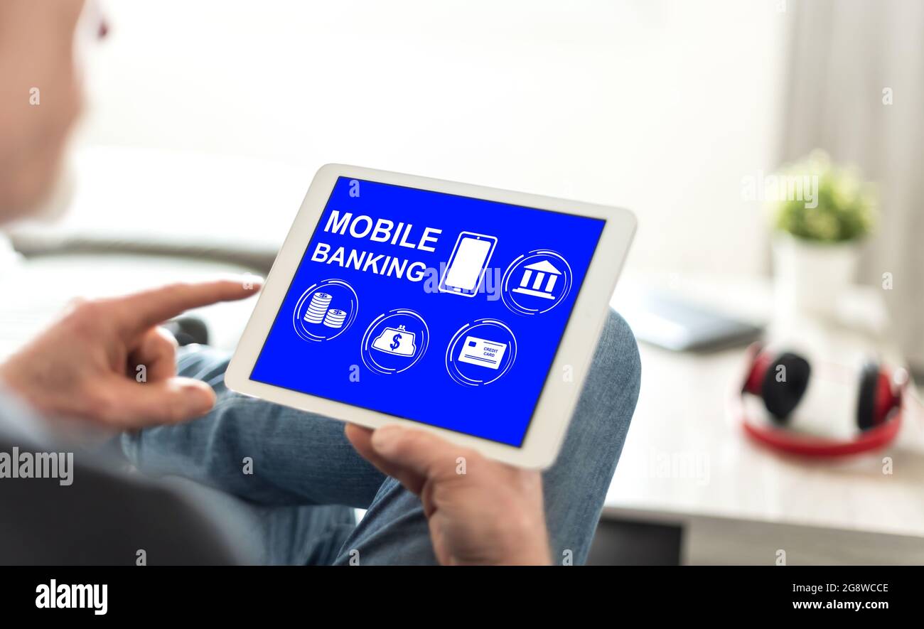 Tablet screen displaying a mobile banking concept Stock Photo - Alamy