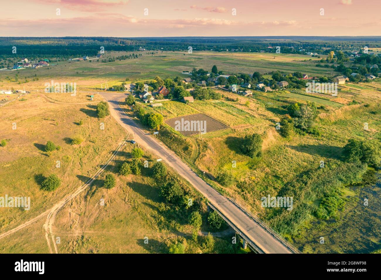 Rural landscape aerial view. View of the village, green fields, bridge ...