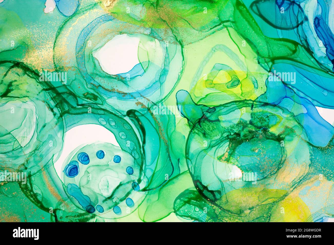 Abstract ink blue, green and yellow watercolor ink circle, drops and ...