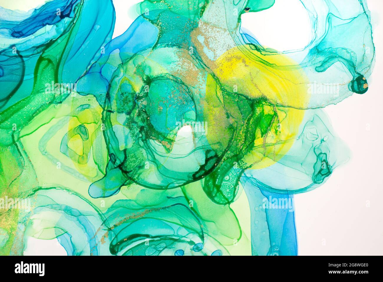 Abstract ink blue, green and yellow watercolor ink circles and ...