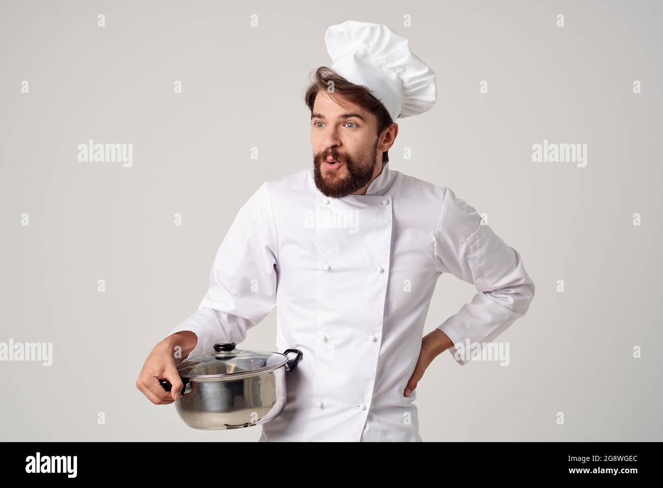 professional chef pot in hand cooking service job Stock Photo - Alamy