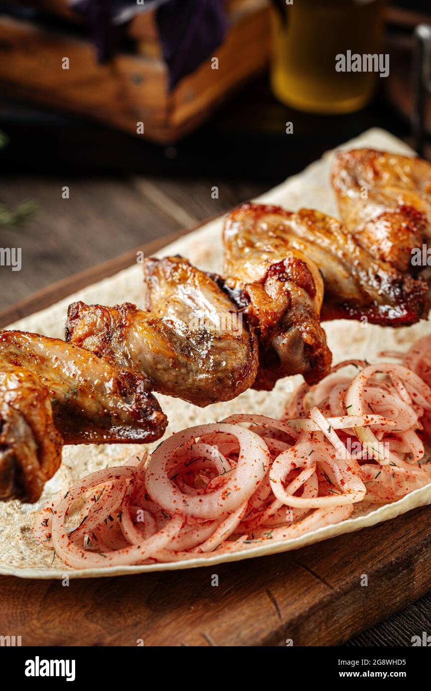 Caucasian chicken wings shashlyq skewers Stock Photo - Alamy