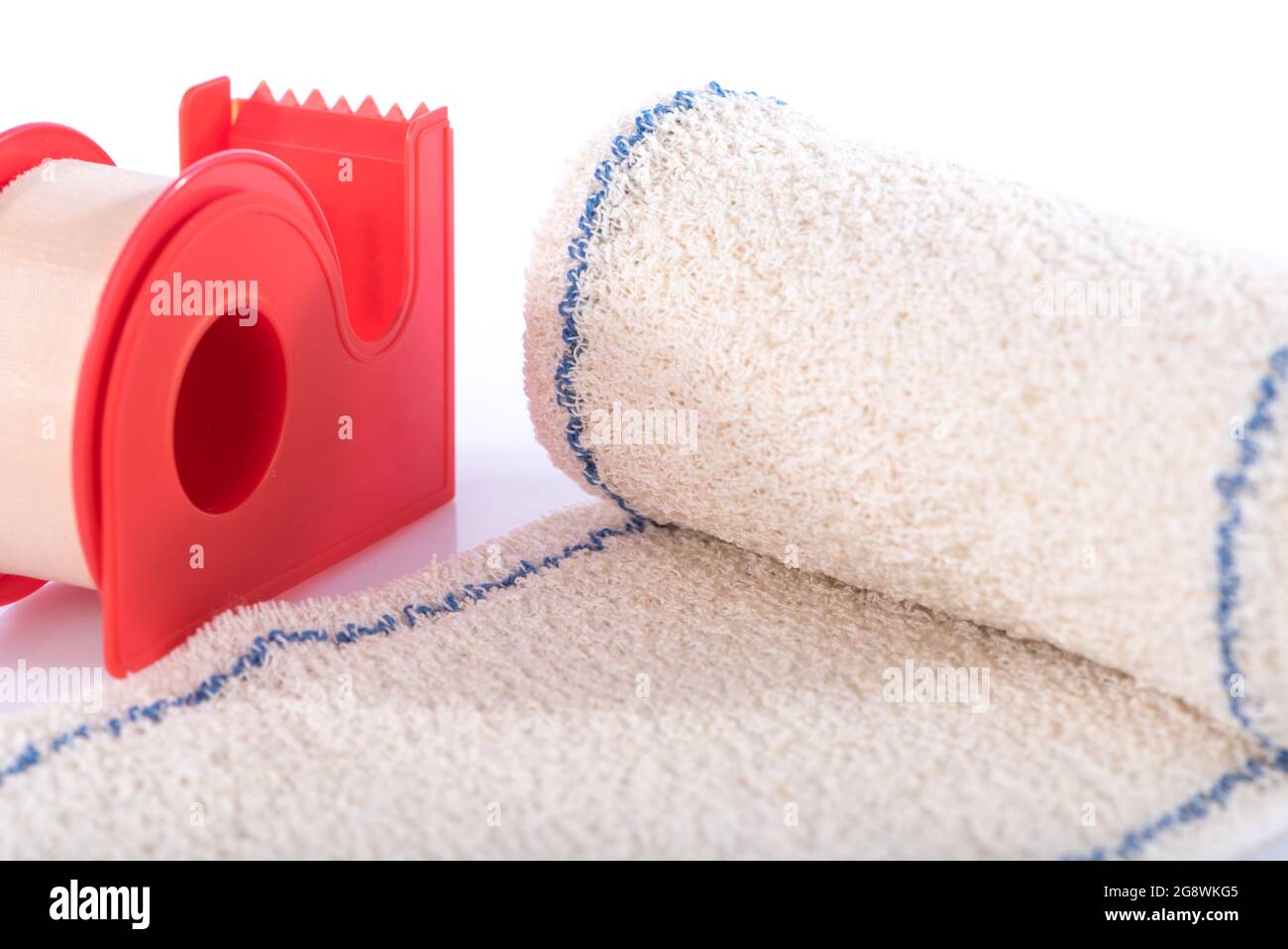 Roll of medical bandage with sticking plaster Stock Photo - Alamy