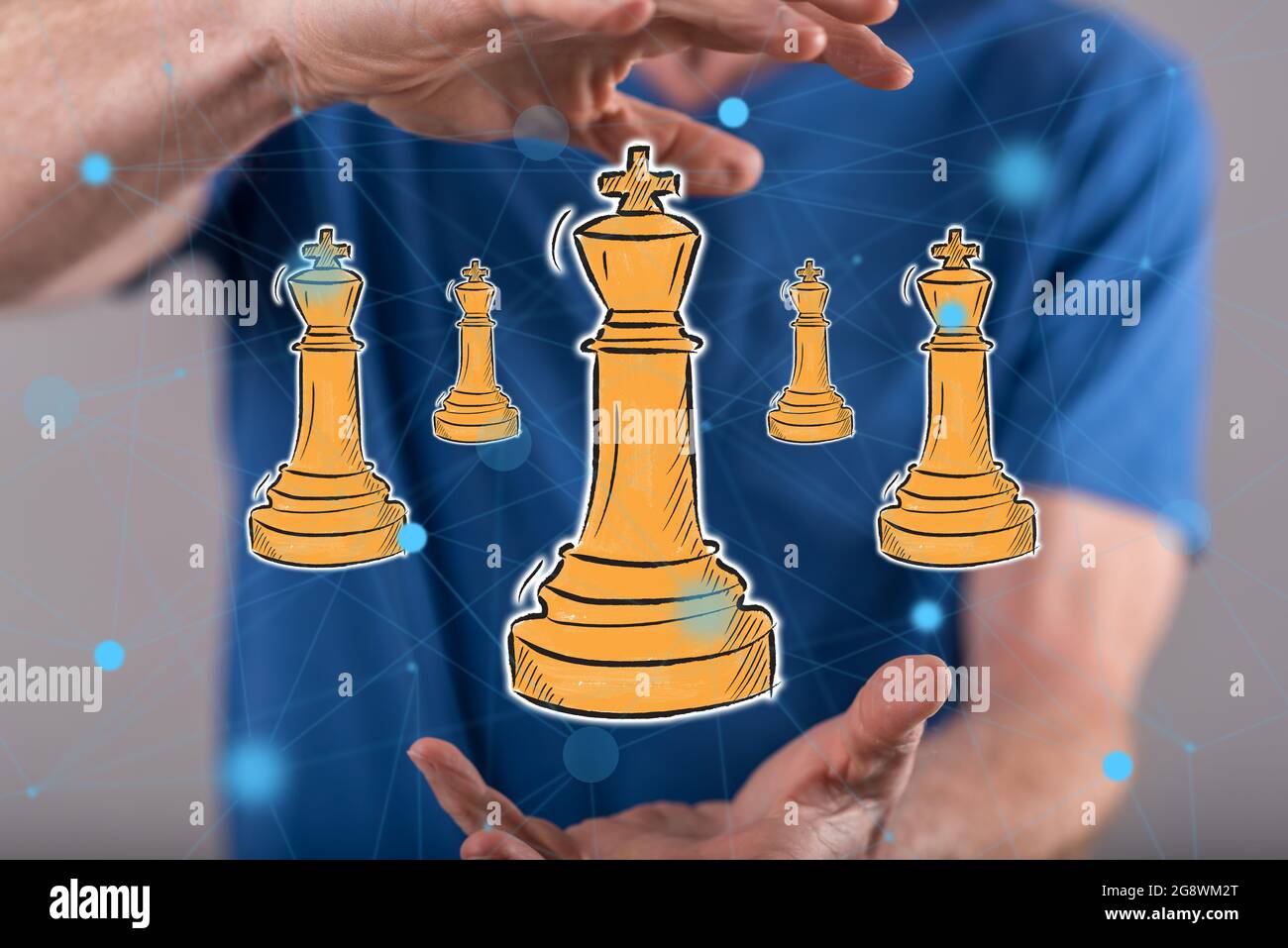 Strategy concept between hands of a man in background Stock Photo - Alamy