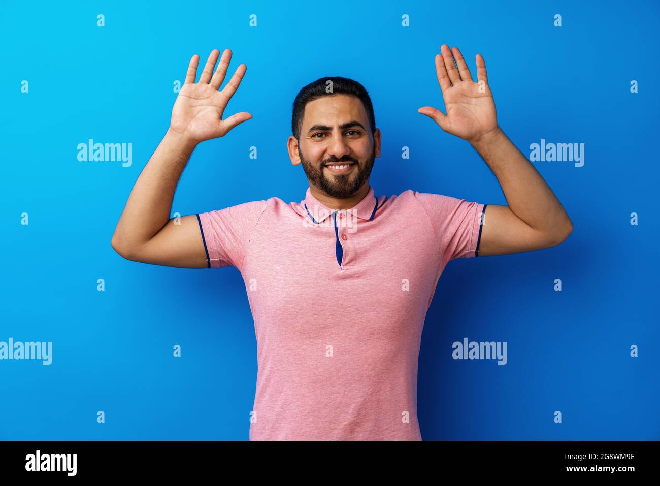Cheerful young arab man victory hi-res stock photography and images - Alamy