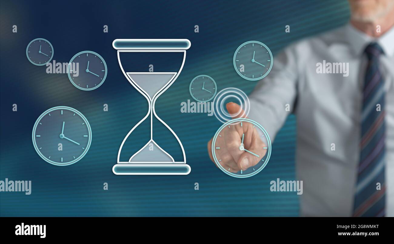 Man touching a time management concept on a touch screen with his ...