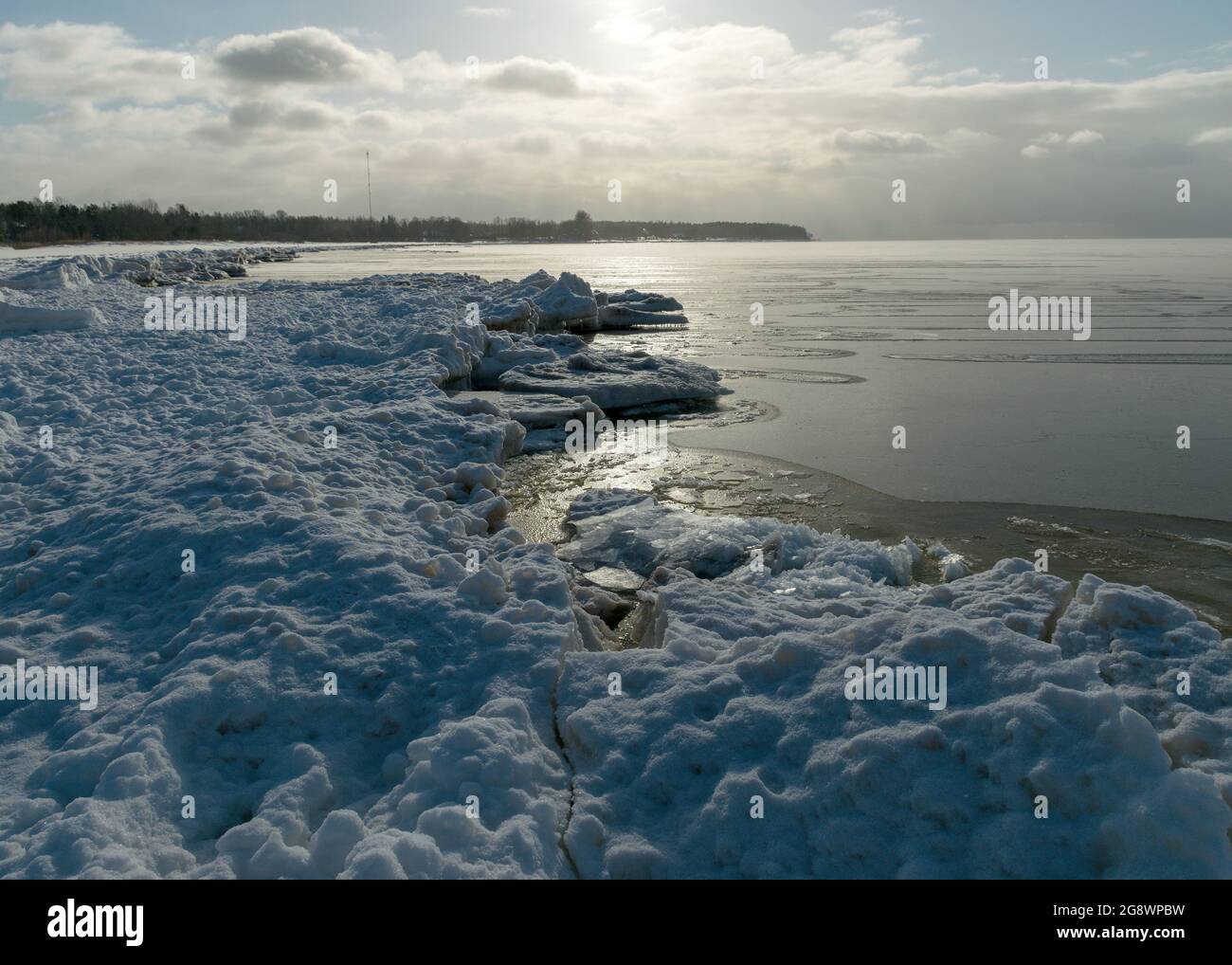 winter landscape by the sea, snowy pieces of ice by the sea and ice ...