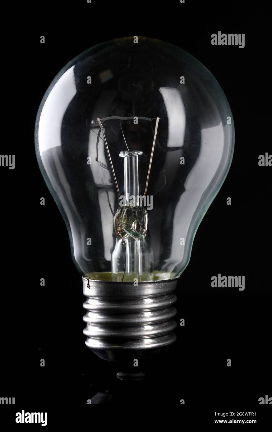 Light bulb on black background Stock Photo - Alamy