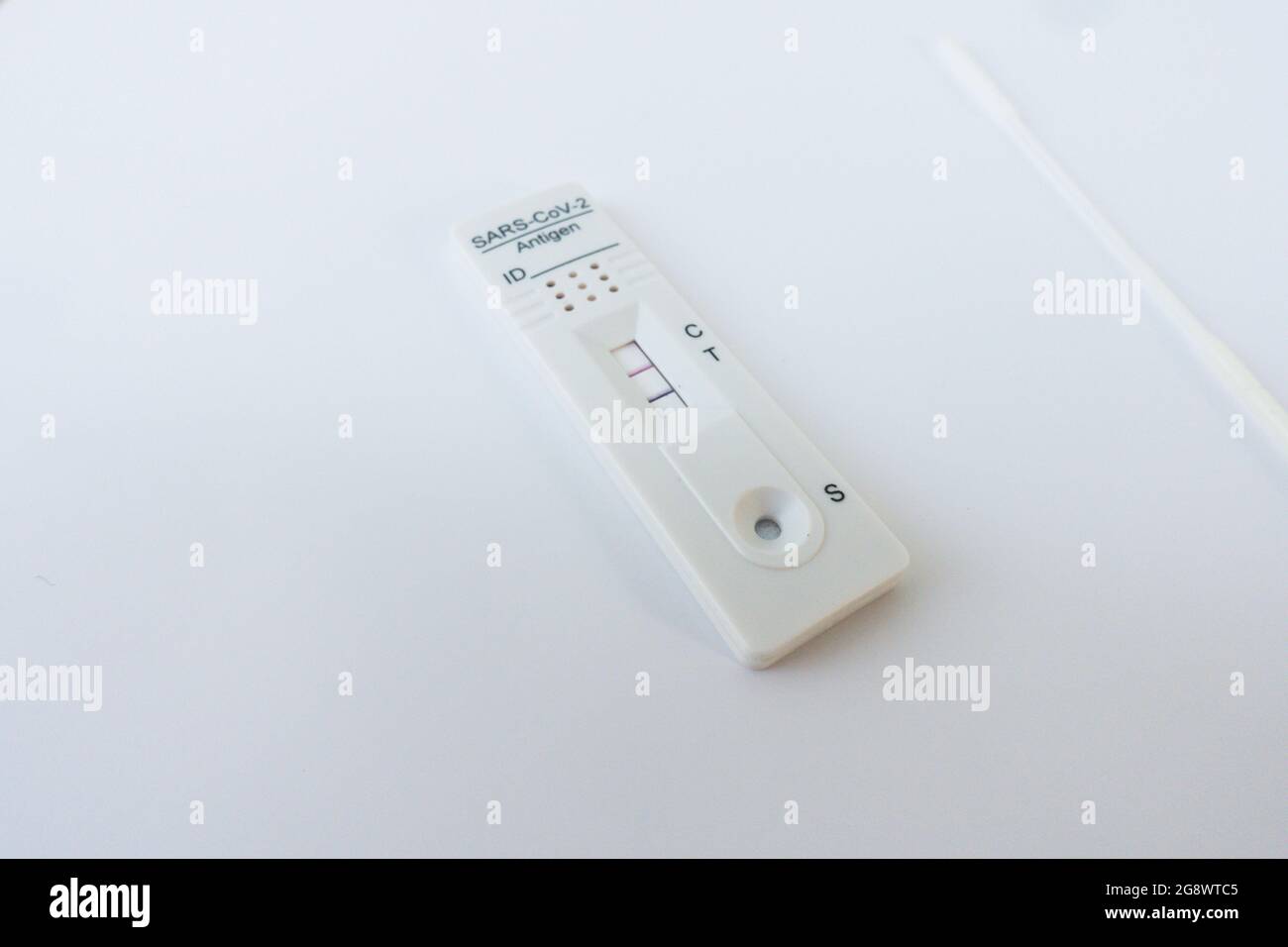 Covid-19 rapid test kit, antigen test, Home test next to swab showing ...