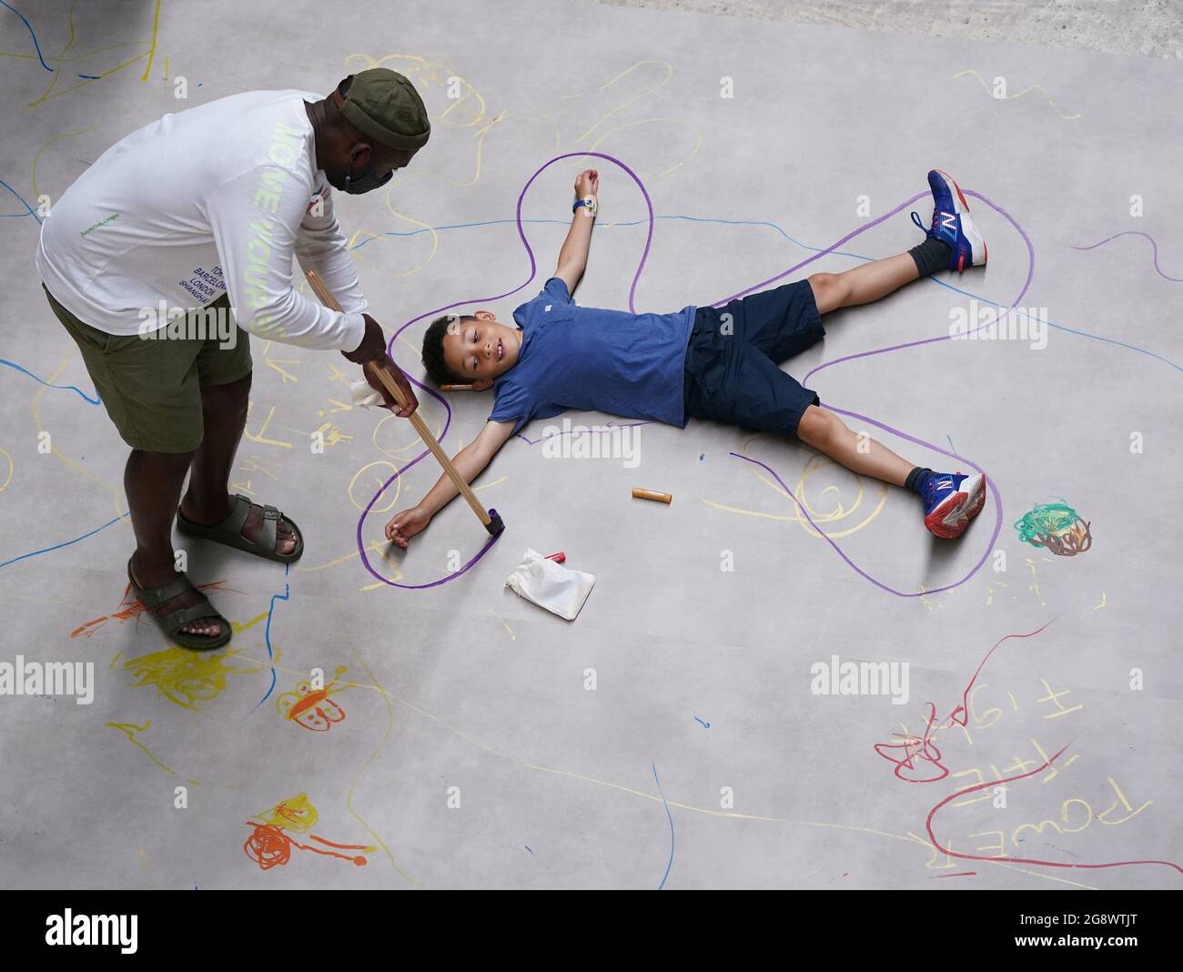 Members of the public interact with Mega Please Draw Freely by artist ...