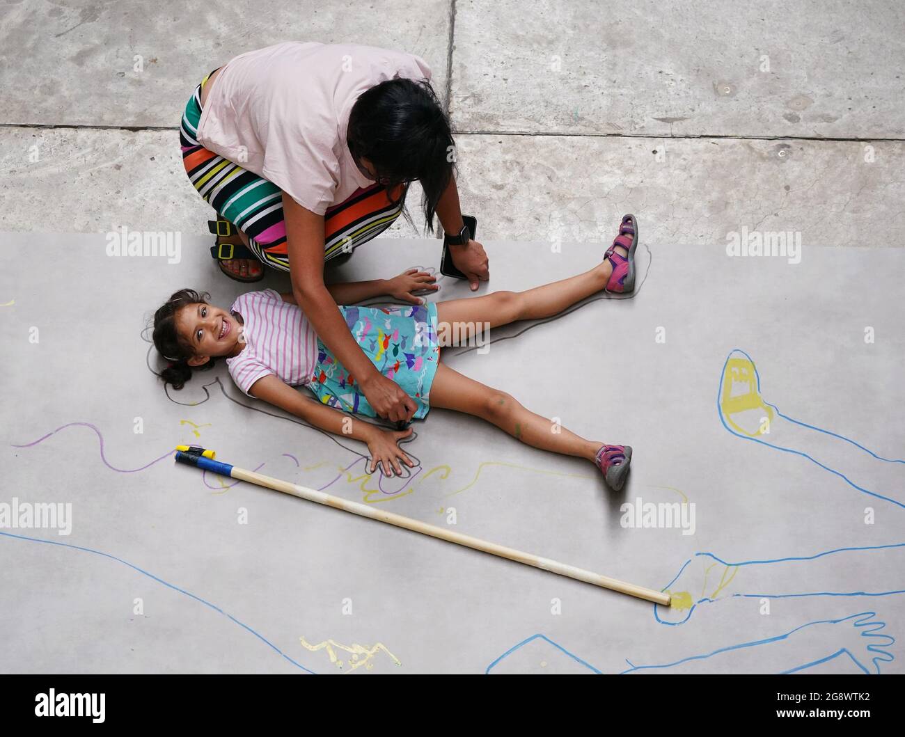 Members of the public interact with Mega Please Draw Freely by artist ...