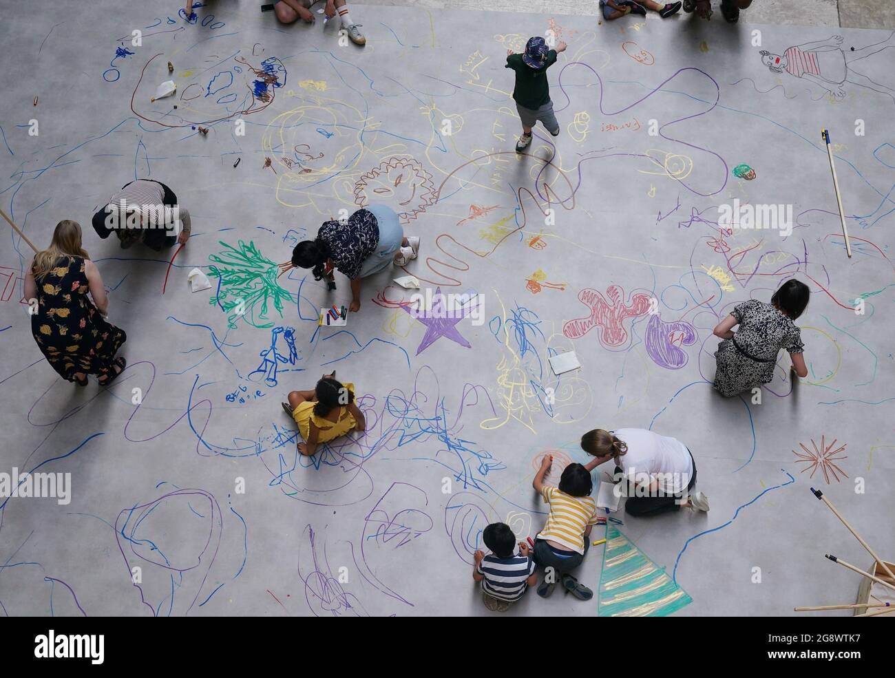 Members of the public interact with Mega Please Draw Freely by artist ...