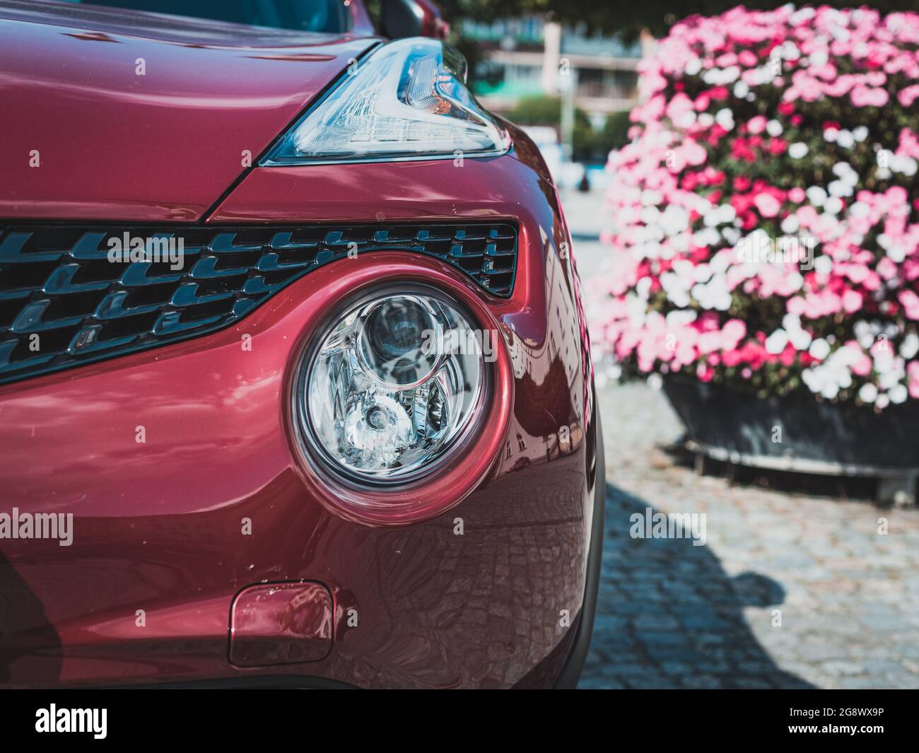 front lights of the red car, vehicle details Stock Photo - Alamy
