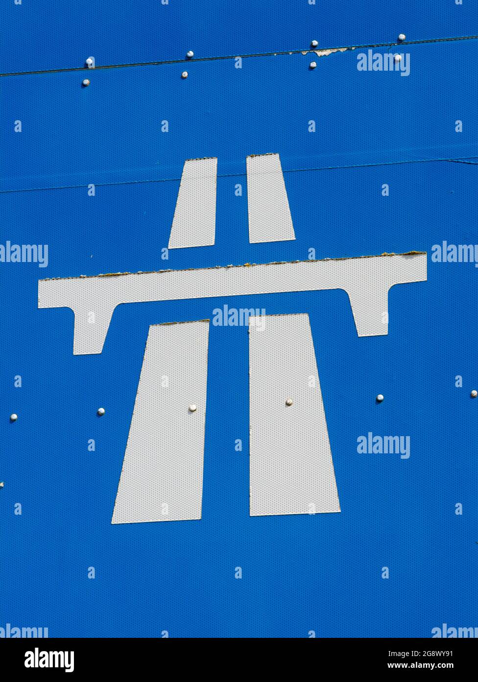 Motorway symbol on a road sign, UK Stock Photo - Alamy