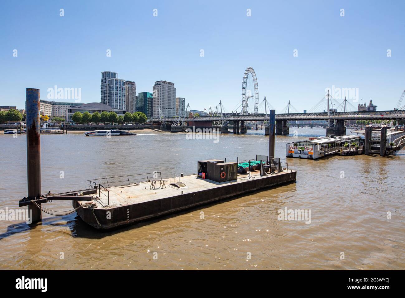 The River Thames at Chelsea, London in midsummer; showing walkways and ...