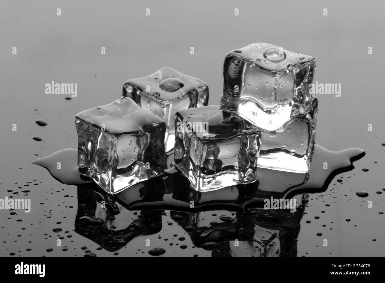 Melting ice cubes on grey background Stock Photo - Alamy