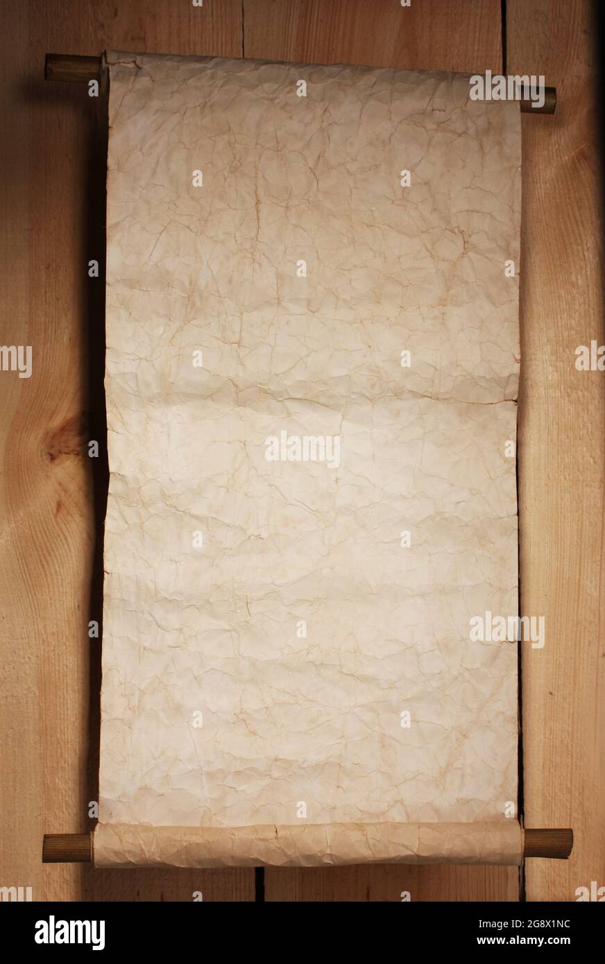 Old scroll on wooden background Stock Photo - Alamy