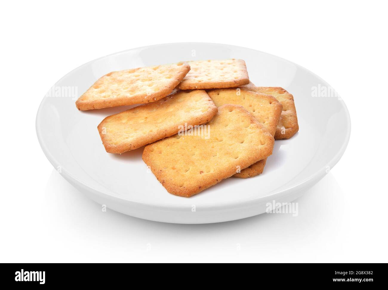 Cracker in plate on white background Stock Photo - Alamy