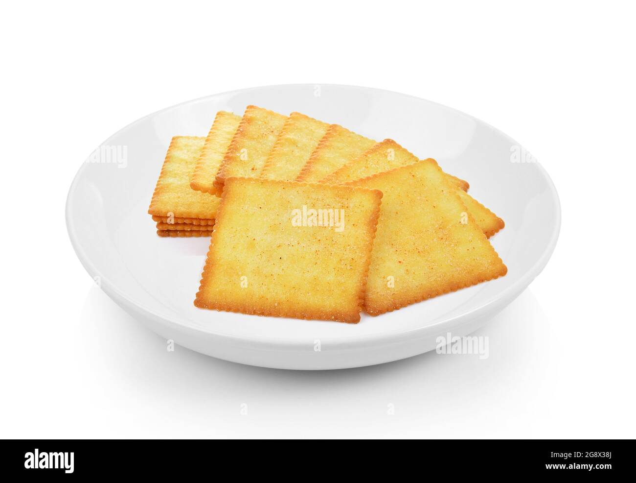 Cracker in plate on white background Stock Photo - Alamy