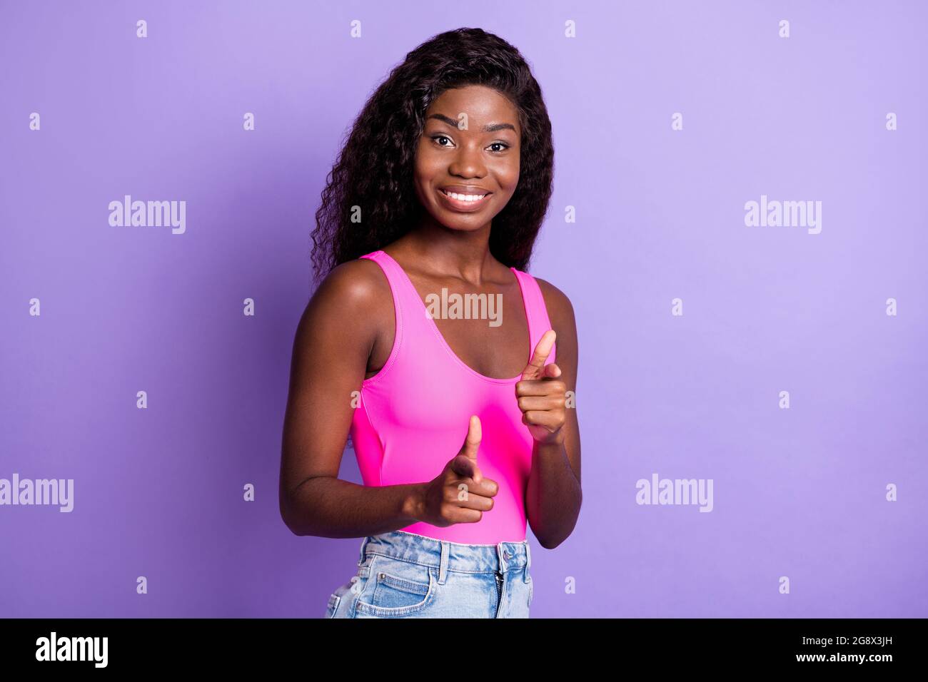 Photo of charming adorable dark skin woman dressed pink tank pointing ...