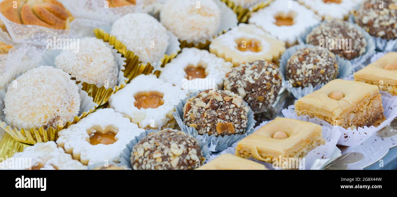 Banner of assortment of traditional oriental pastries presented in a ...