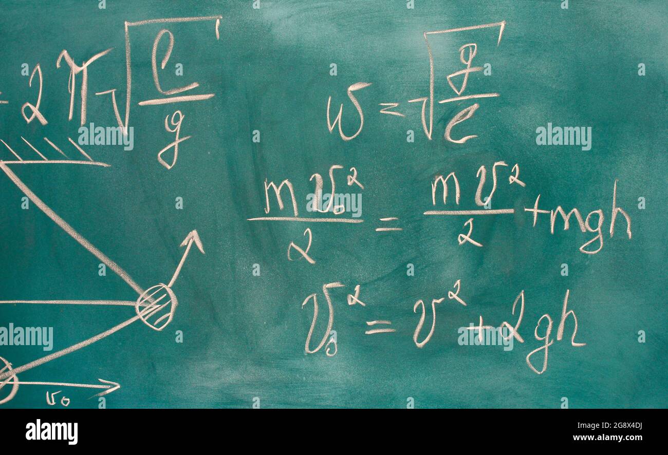 formulas written on green chalkboard Stock Photo - Alamy