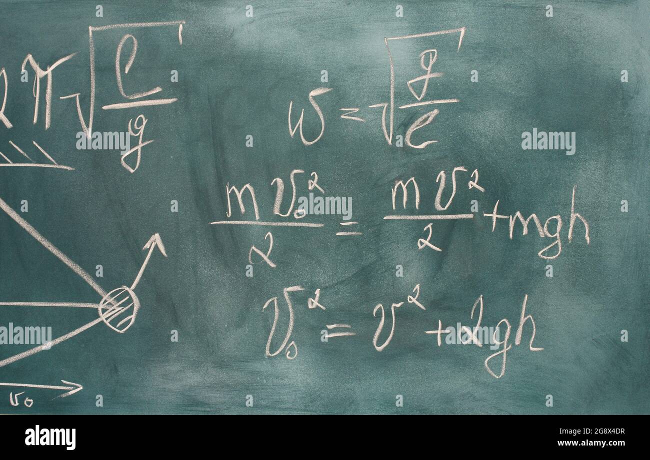 formulas written on green chalkboard Stock Photo - Alamy