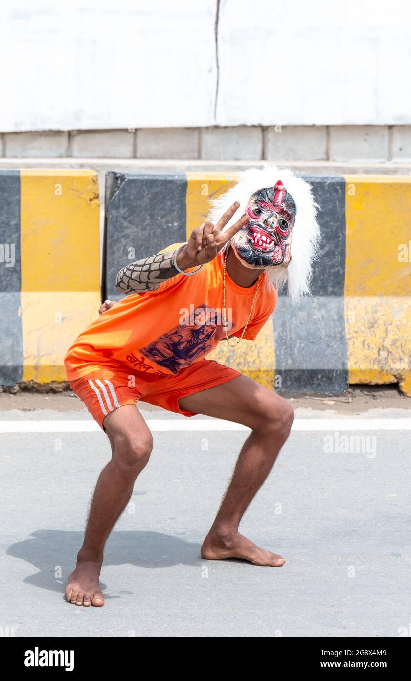 GHAZIABAD, INDIA - JULY 2019: A hindu devotee carrying kanwar on their ...