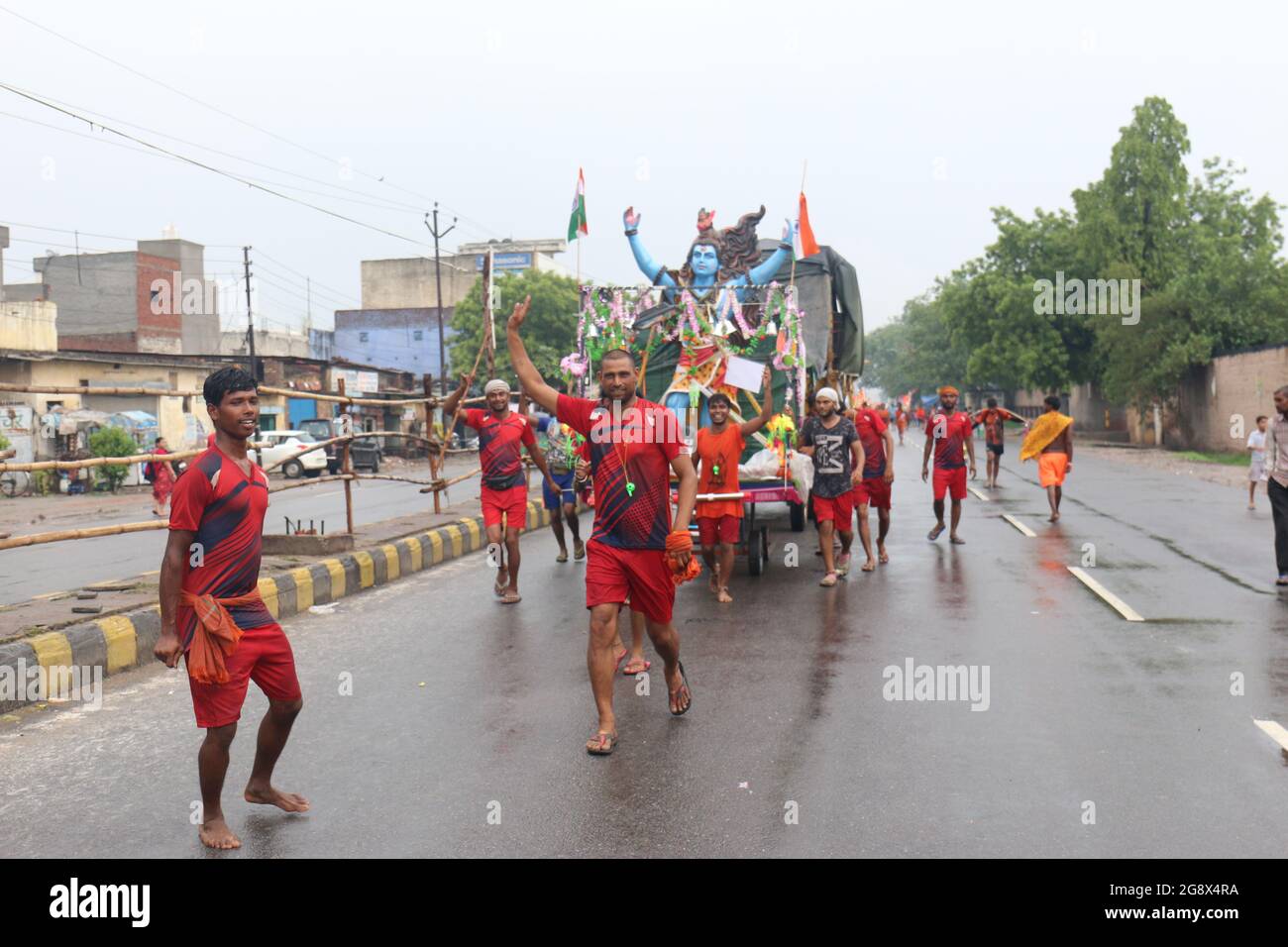 GHAZIABAD, INDIA - JULY 2019: A hindu devotee carrying kanwar on their ...