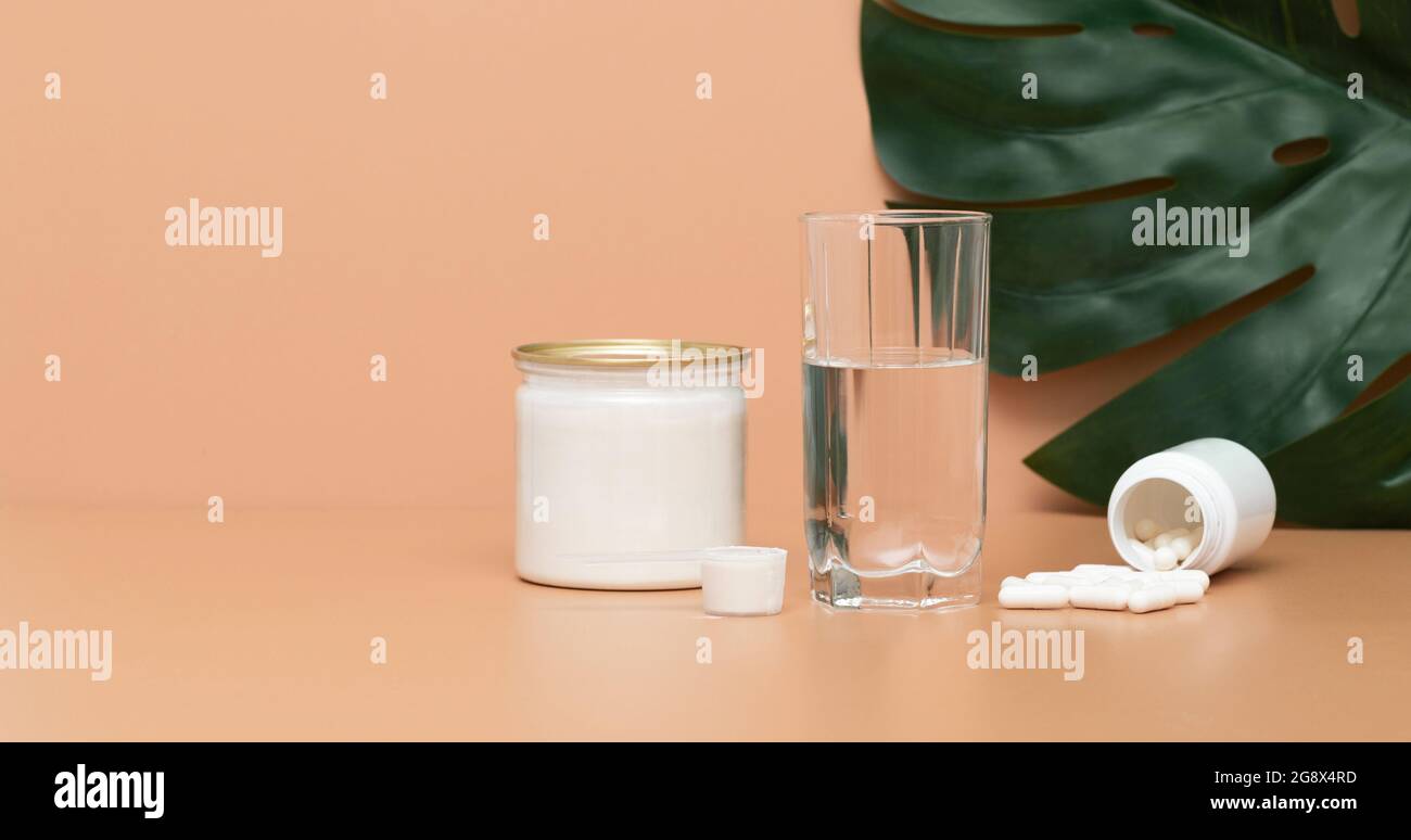 Collagen on a beige background. Banner. Collagen protein powder and ...