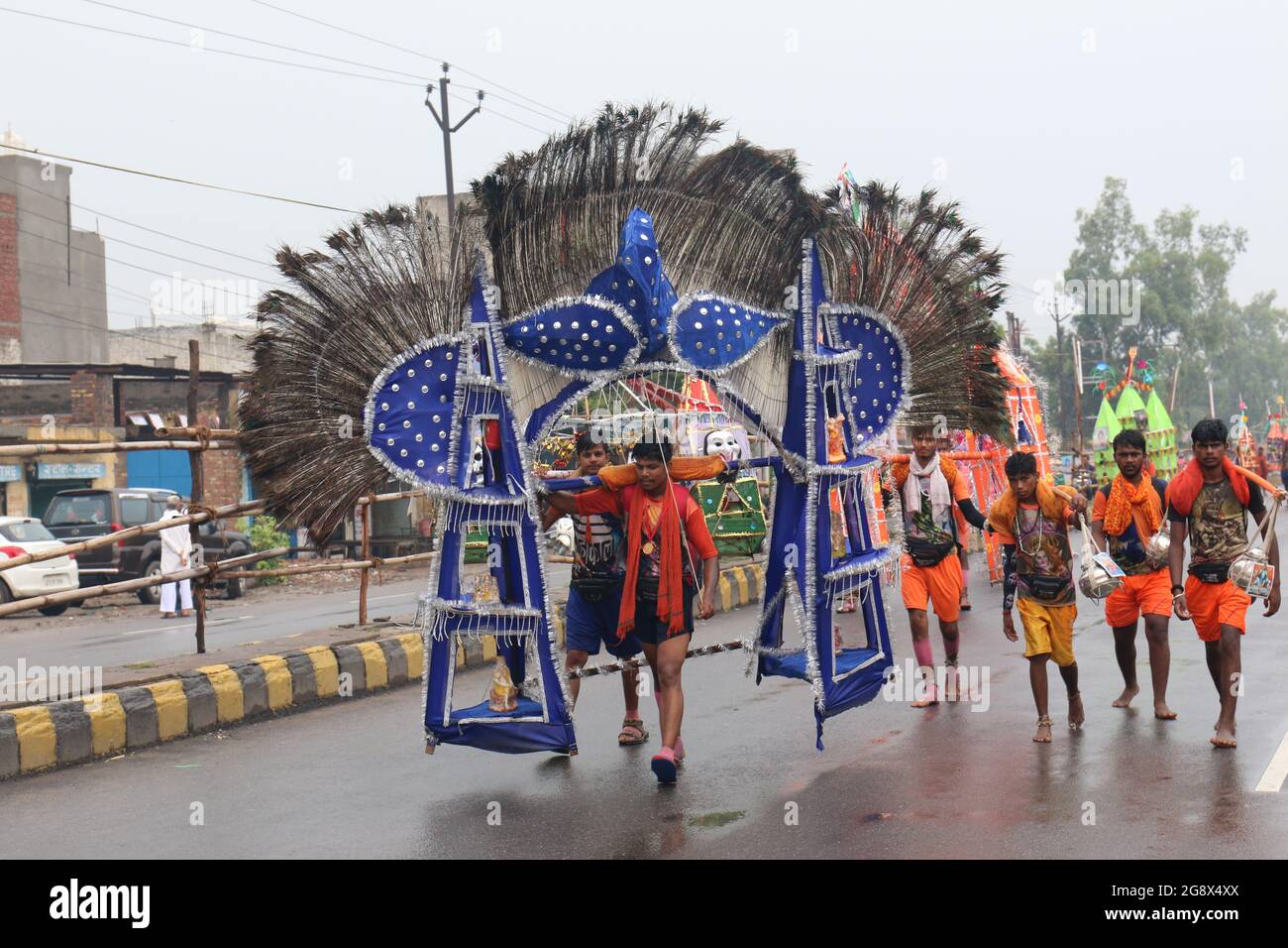 GHAZIABAD, INDIA - JULY 2019: A hindu devotee carrying kanwar on their ...