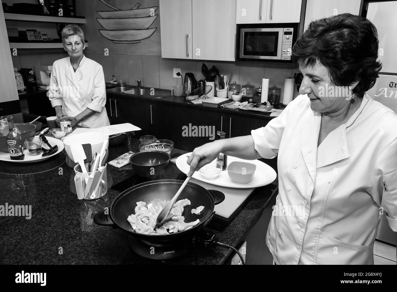 JOHANNESBURG, SOUTH AFRICA - Jan 05, 2021: Two women learning to cook ...