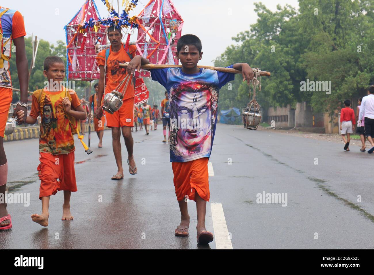 GHAZIABAD, INDIA - JULY 2019: A hindu devotee carrying kanwar on their ...