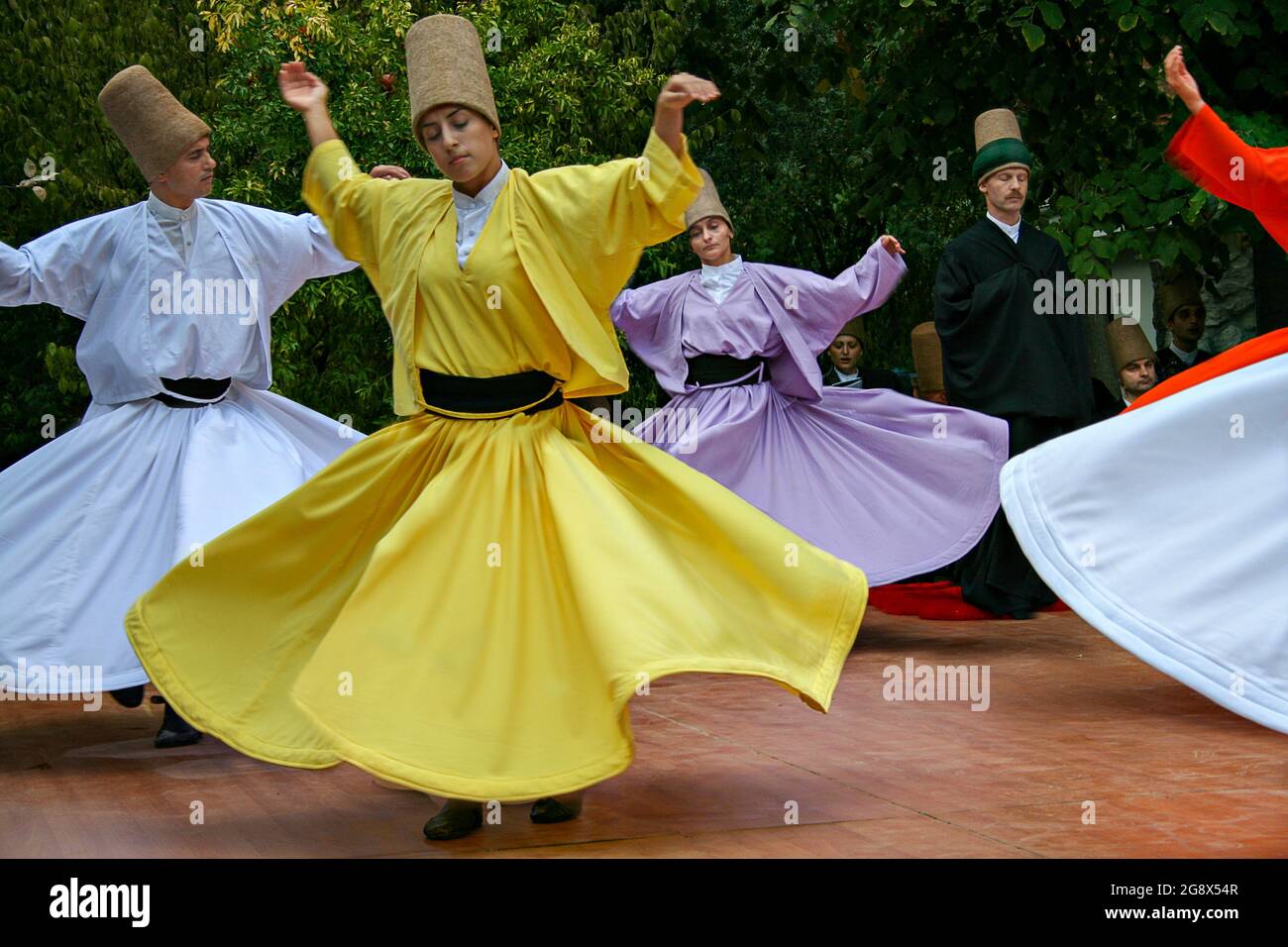 Whirling dervishes during Sufi whirling ritual performance known as ...