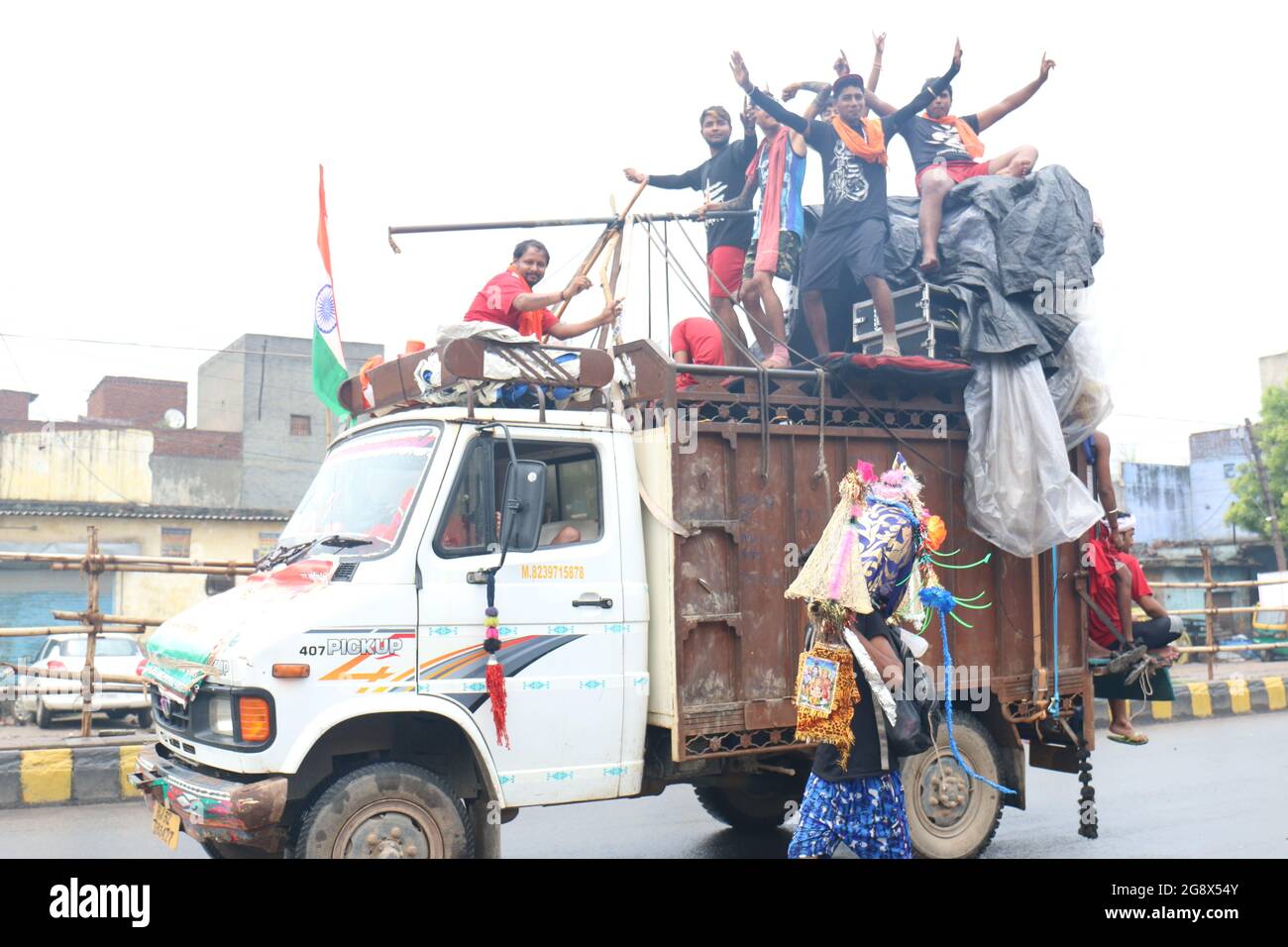 GHAZIABAD, INDIA - JULY 2019: A hindu devotee carrying kanwar on their ...
