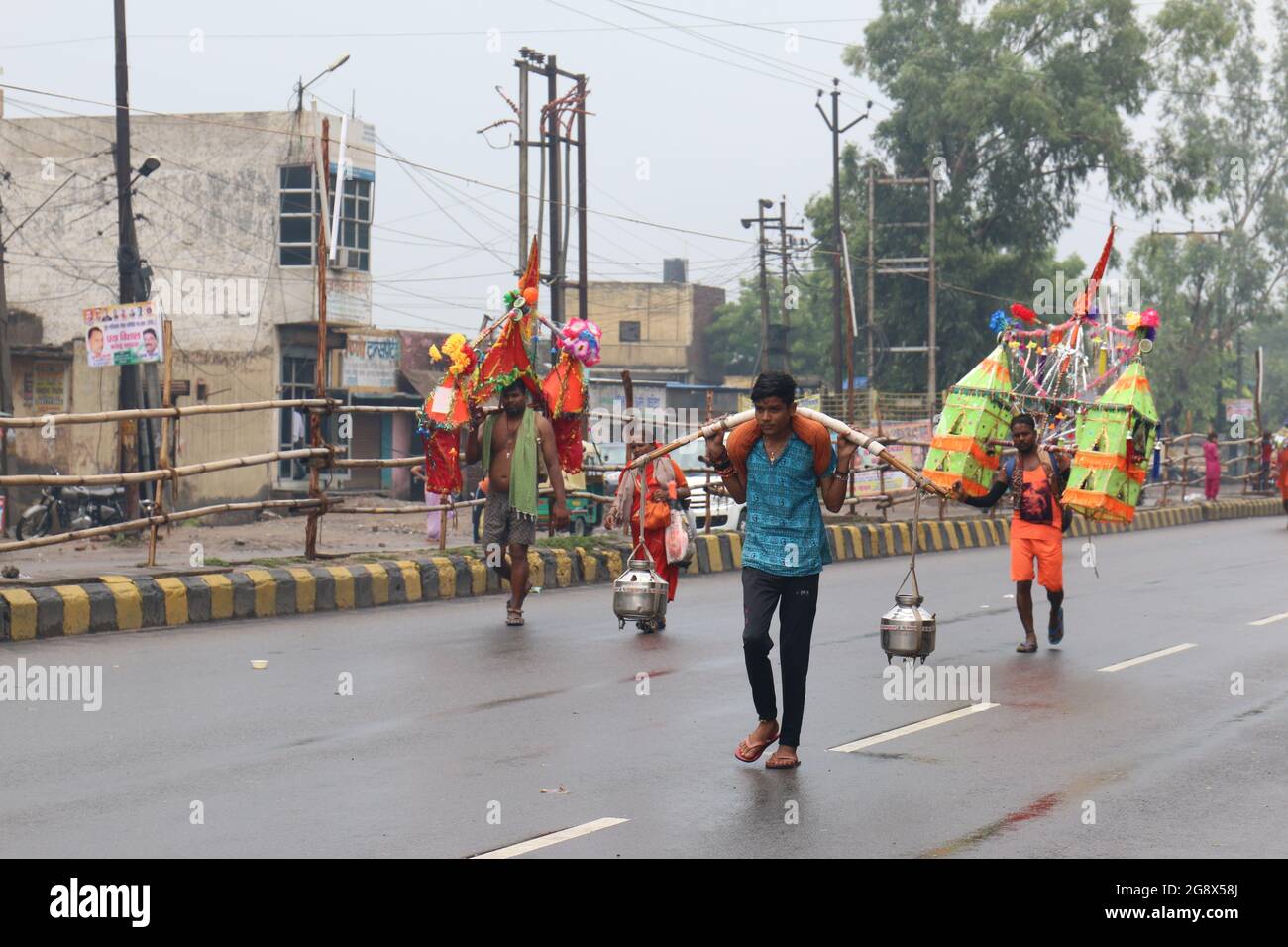 GHAZIABAD, INDIA - JULY 2019: A hindu devotee carrying kanwar on their ...