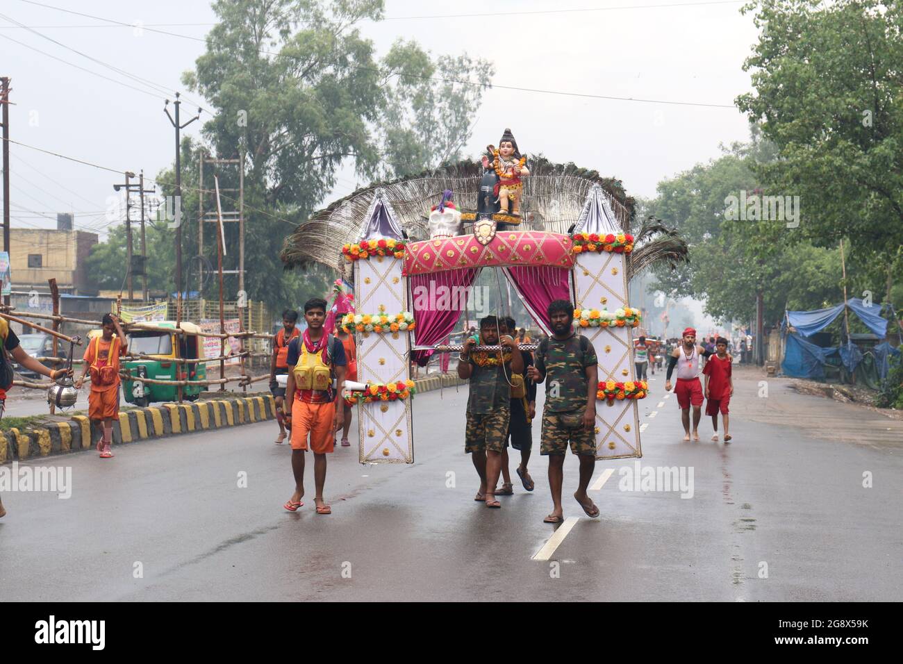 GHAZIABAD, INDIA - JULY 2019: A hindu devotee carrying kanwar on their ...