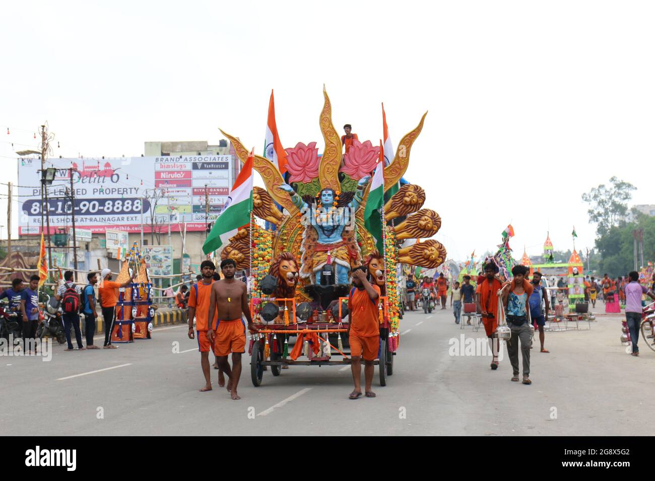GHAZIABAD, INDIA - JULY 2019: A hindu devotee carrying kanwar on their ...