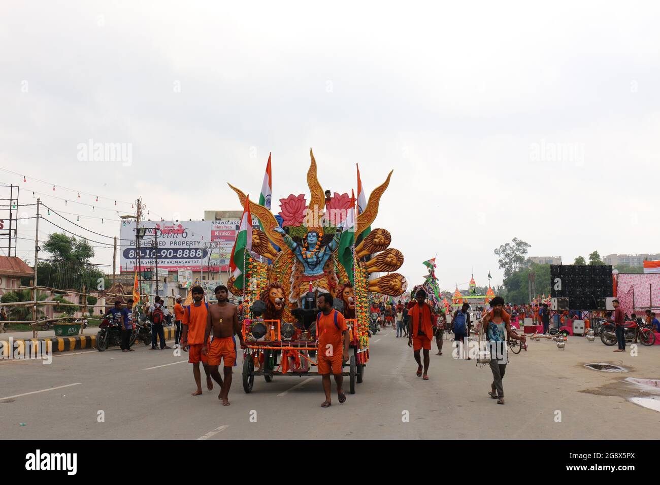 GHAZIABAD, INDIA - JULY 2019: A hindu devotee carrying kanwar on their ...