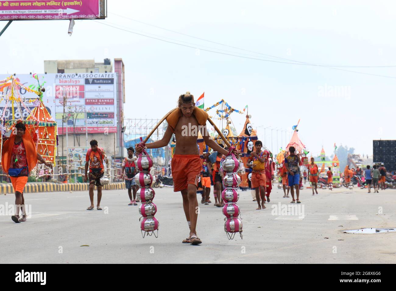 GHAZIABAD, INDIA - JULY 2019: A hindu devotee carrying kanwar on their ...