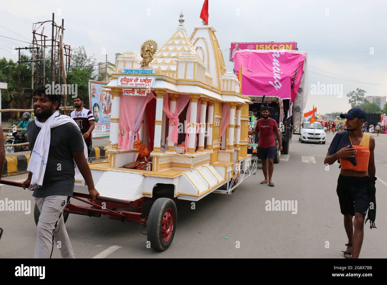GHAZIABAD, INDIA - JULY 2019: A hindu devotee carrying kanwar on their ...