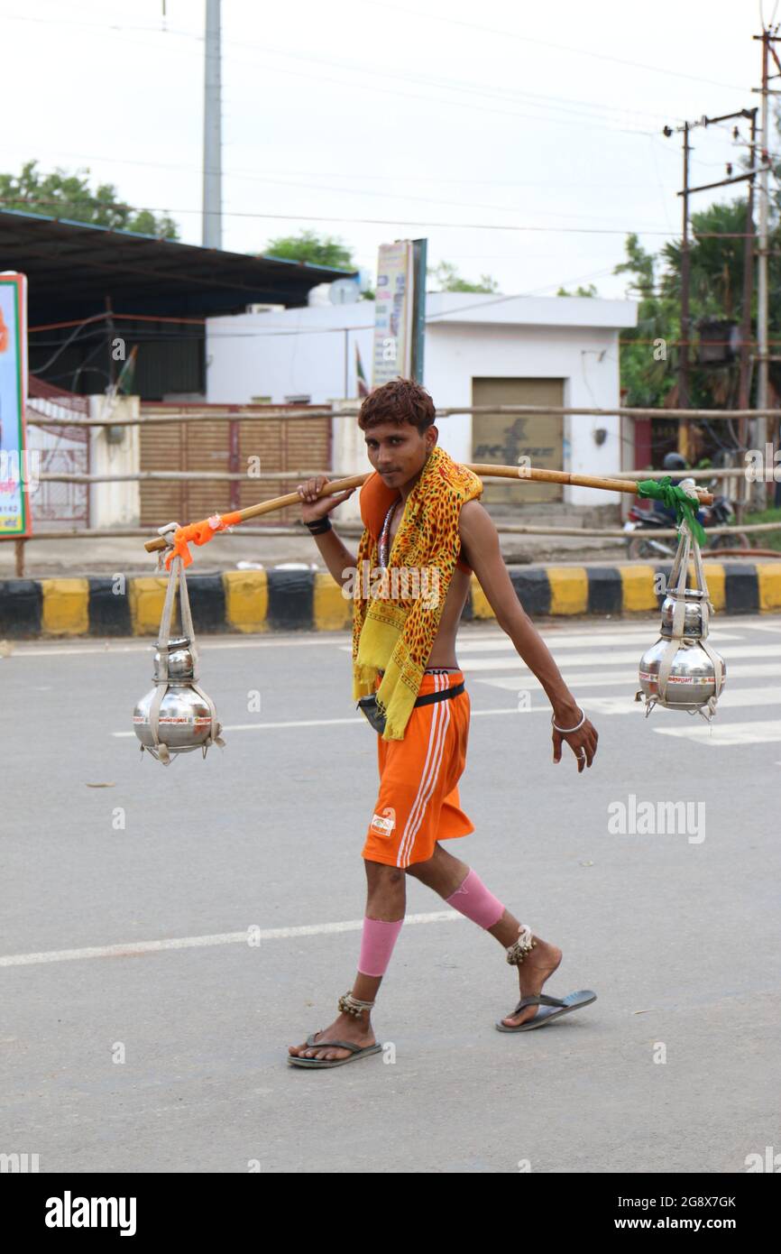 GHAZIABAD, INDIA - JULY 2019: A hindu devotee carrying kanwar on their ...