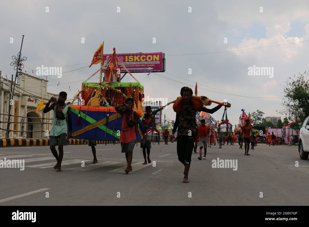 GHAZIABAD, INDIA - JULY 2019: A hindu devotee carrying kanwar on their ...