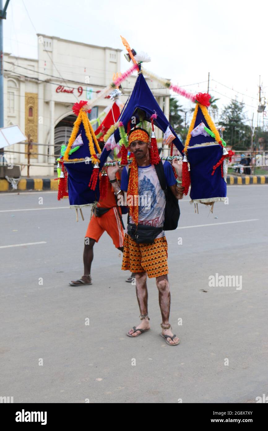 GHAZIABAD, INDIA - JULY 2019: A hindu devotee carrying kanwar on their ...