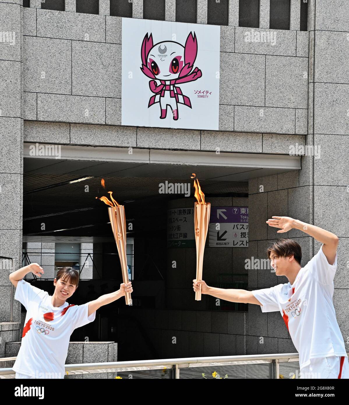 Tokyo, Japan. 23rd July, 2021. Torchbearers pose for the cameras during ...