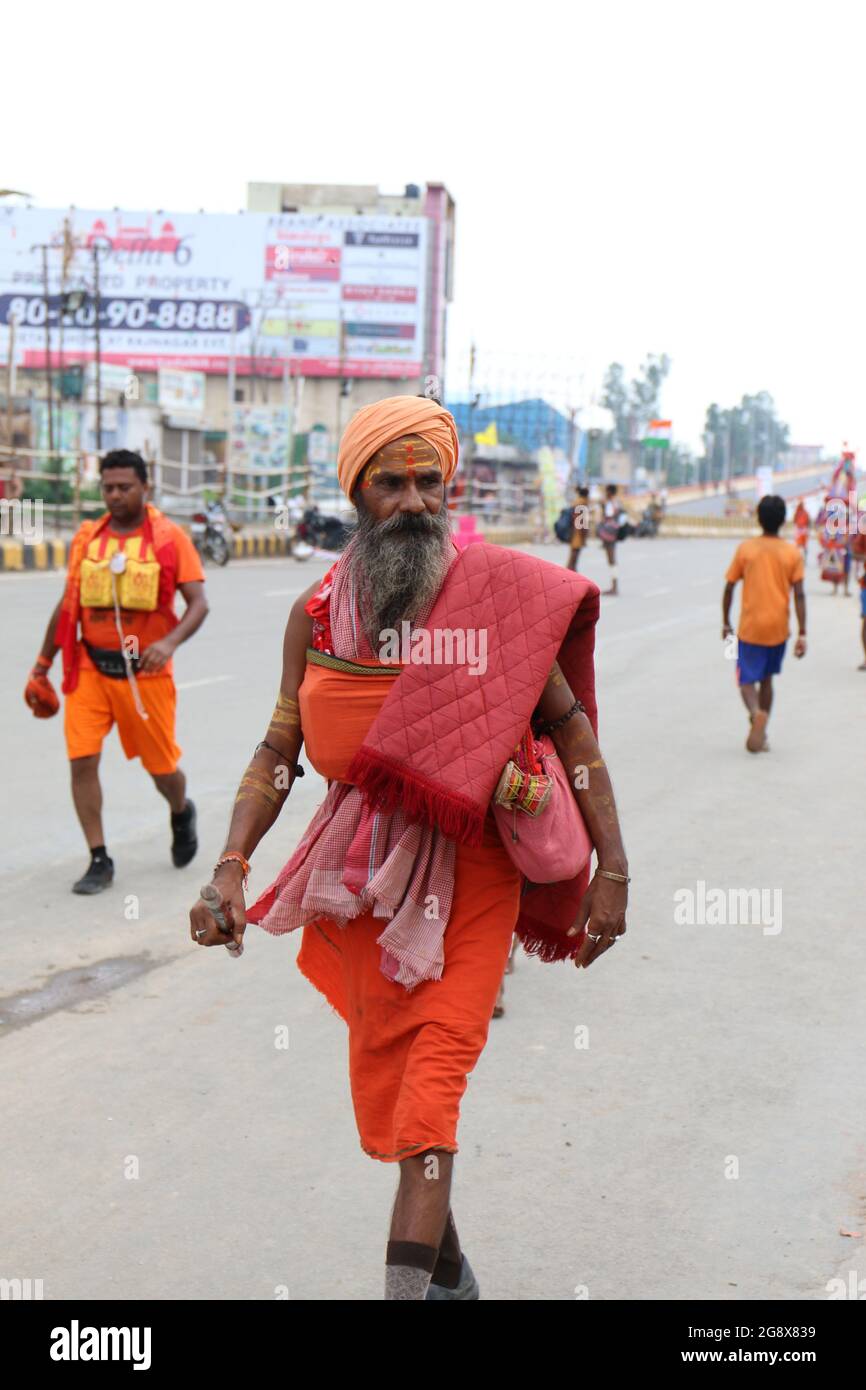 GHAZIABAD, INDIA - JULY 2019: A hindu devotee carrying kanwar on their ...